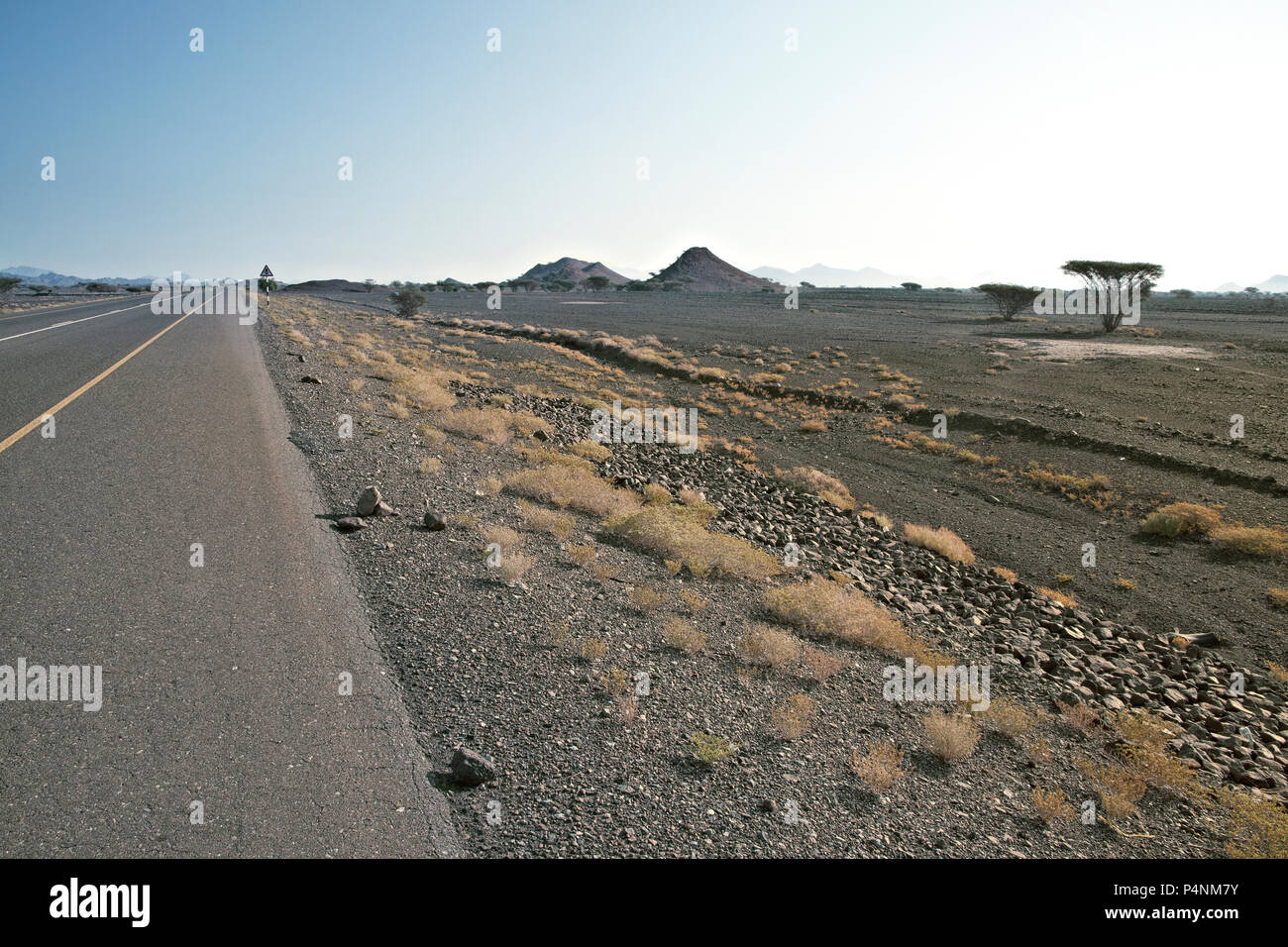wadi road towards hills in oman Stock Photo - Alamy