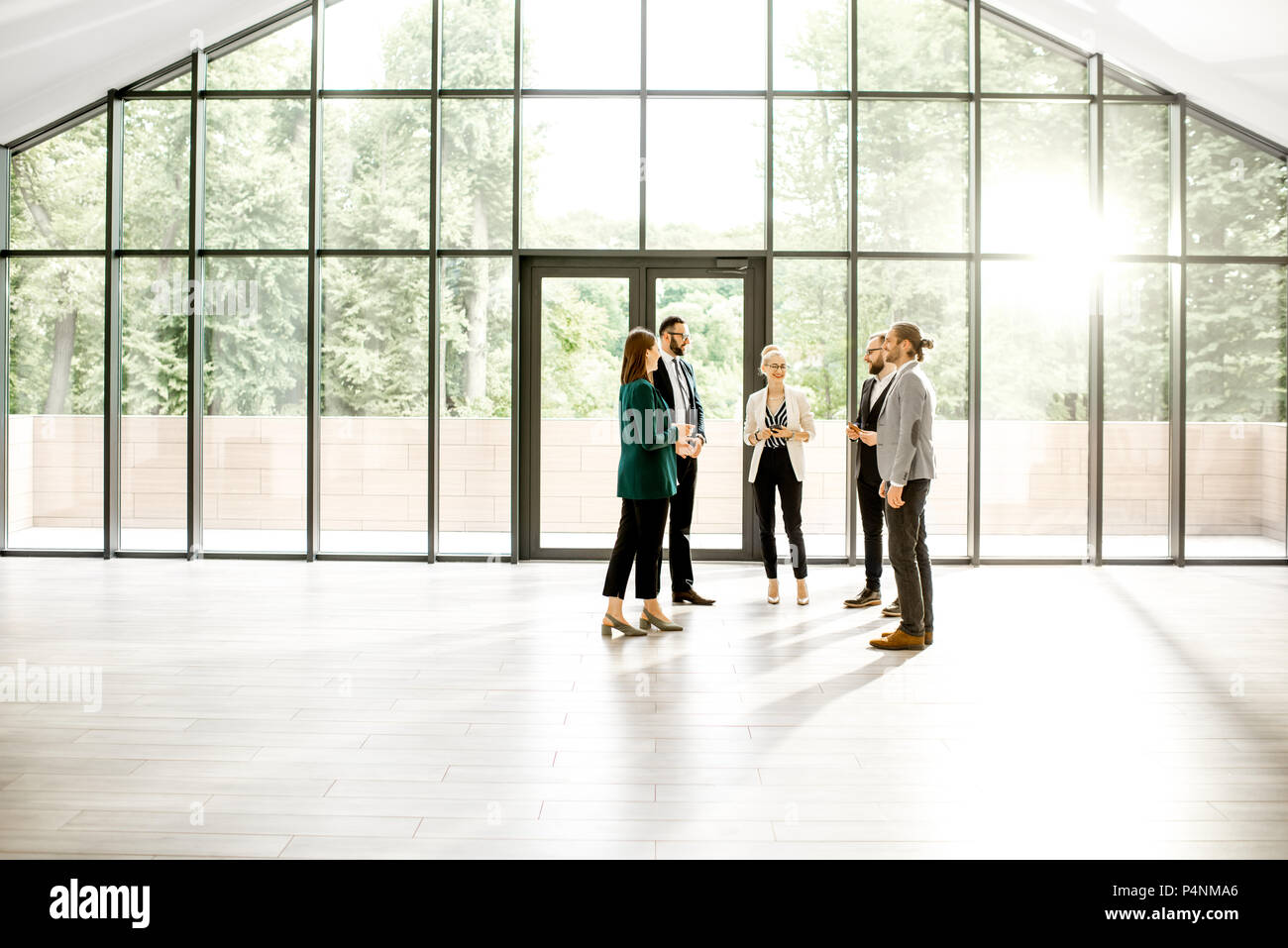 Business people at the modern office hall Stock Photo - Alamy