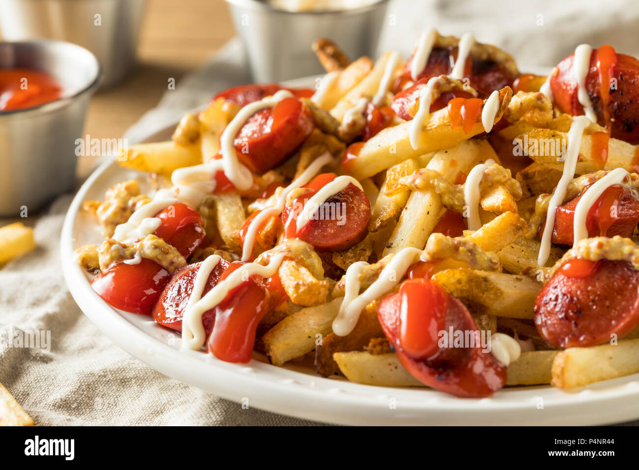 Homemade Peruvian Salchipapa Fries with Mayo Ketchup and Mustard Stock ...