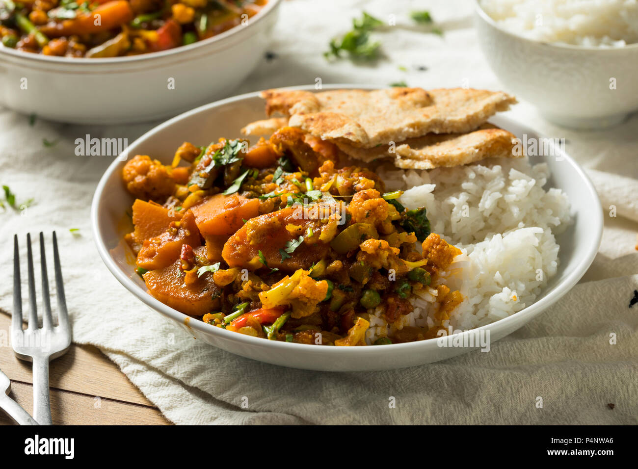 Homemade Spicy Vegan Vegetable Curry with Rice and Naan Stock Photo - Alamy