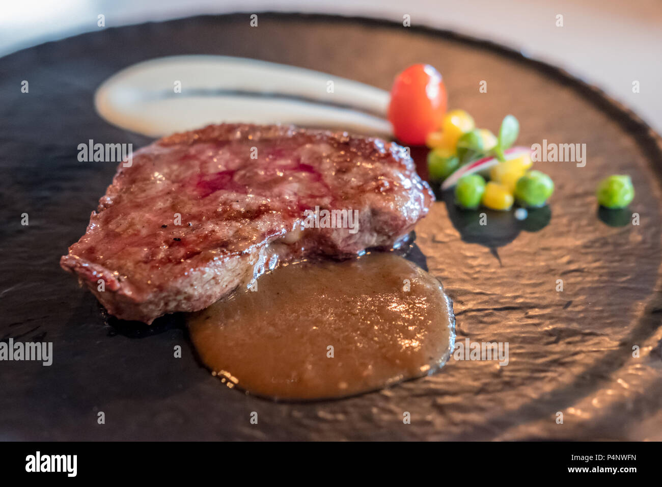 Medium rare meat on plate with sauce Stock Photo - Alamy