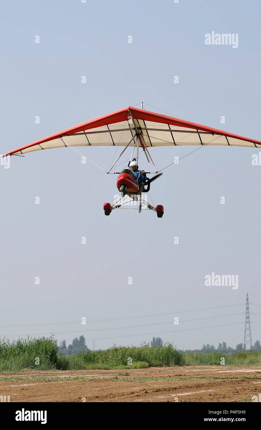 Yinchuan, China. 23rd June 2018. Liu Yibing flies a powered hang glider ...