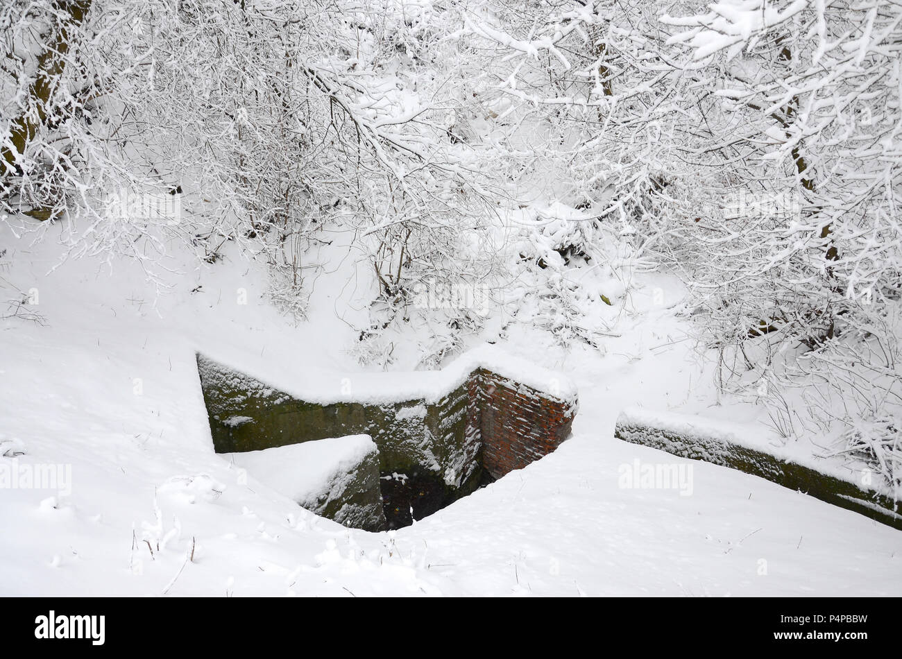 Underground bunker of old brick walls in winter after snowfall Stock ...