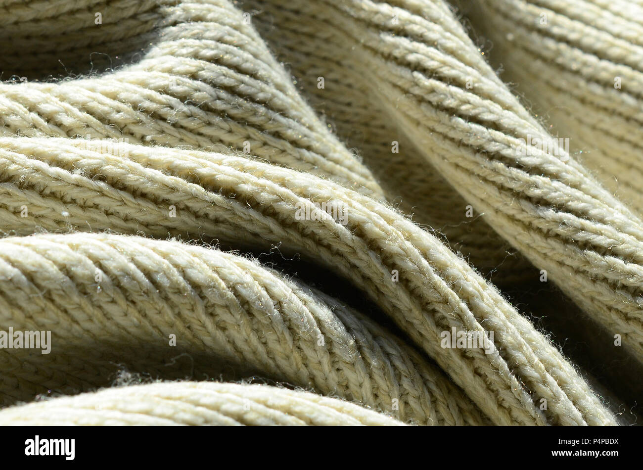 Fabric texture of a soft yellow knitted sweater. Macro image of the ...