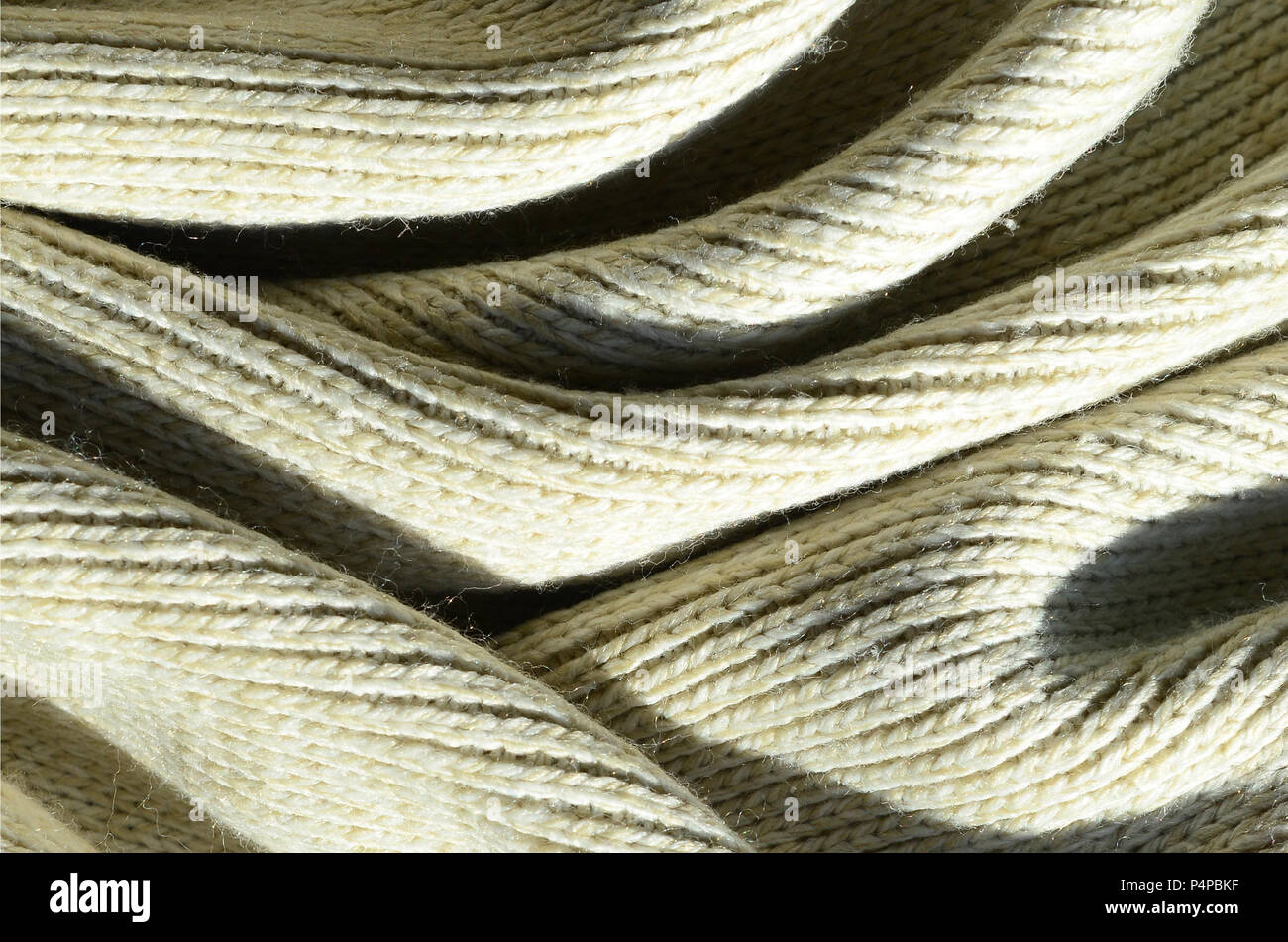 Fabric texture of a soft yellow knitted sweater. Macro image of the ...