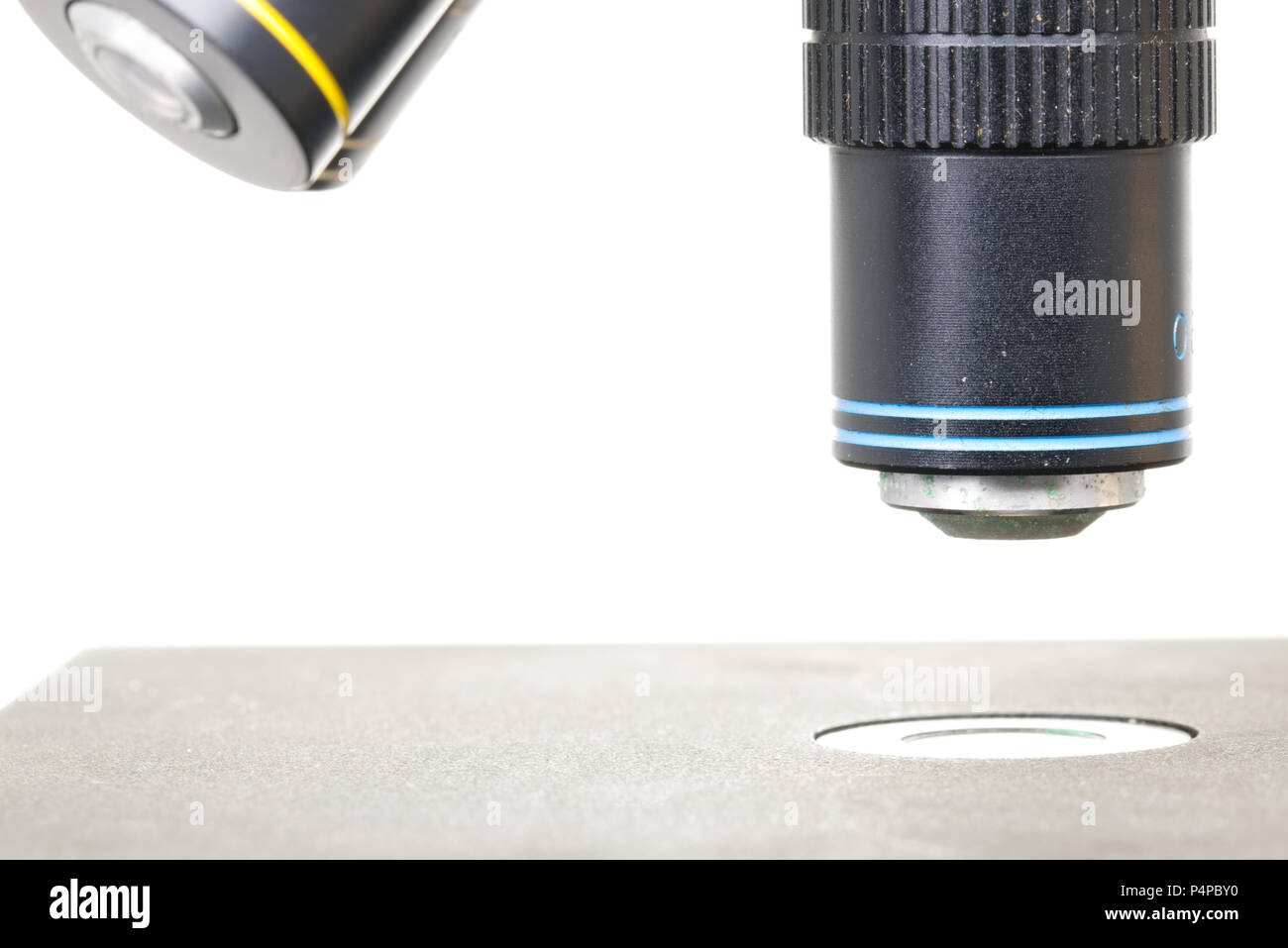 Close up of the lenses of a microscope on white background, Scientific ...