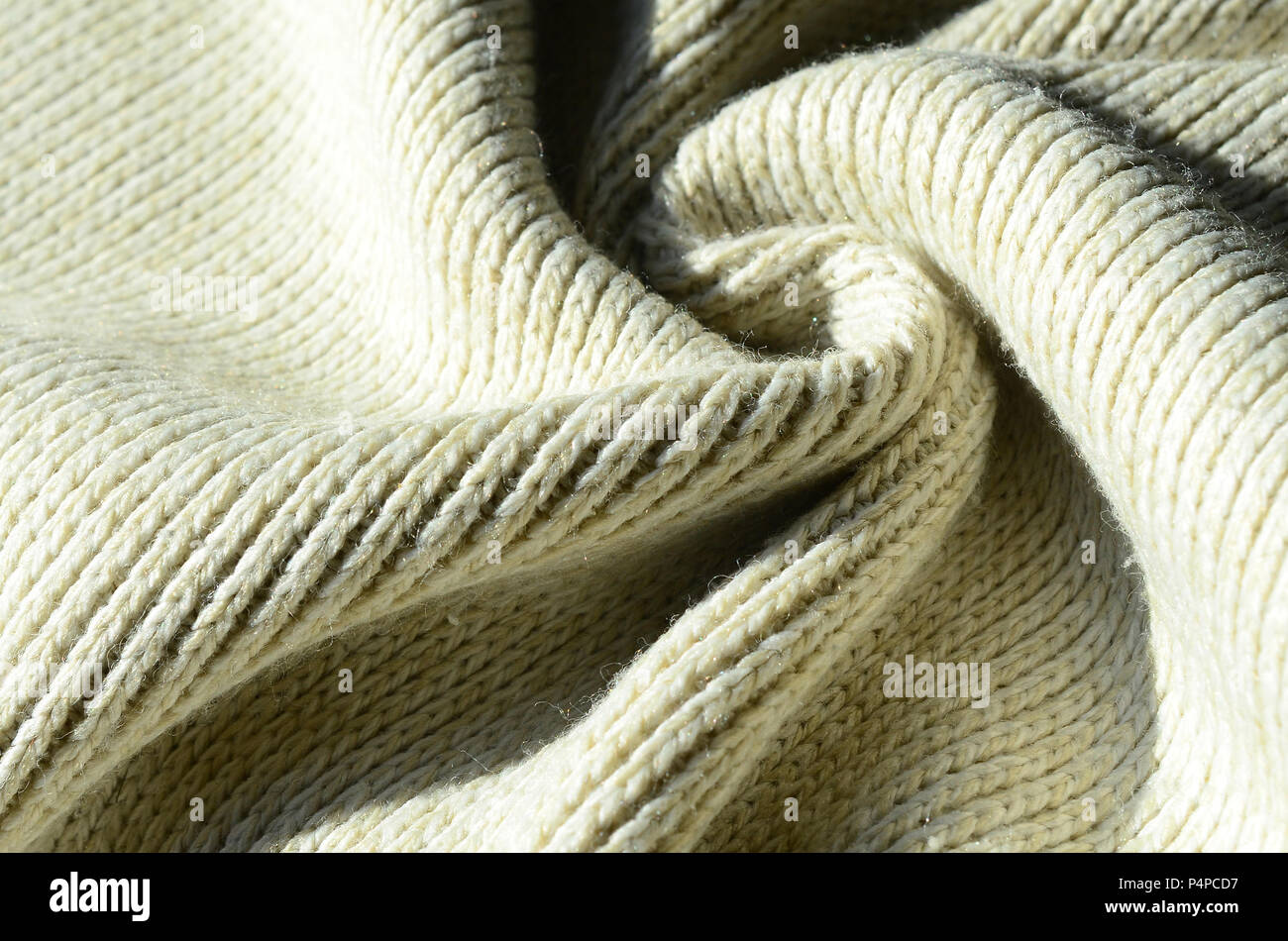 Fabric texture of a soft yellow knitted sweater. Macro image of the ...
