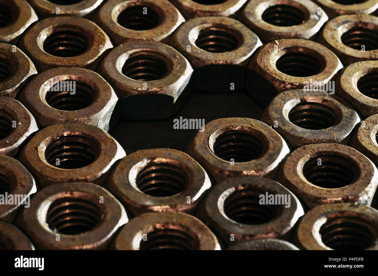 Closeup of a pile of rusty nuts. Retro industrial concept Stock Photo ...