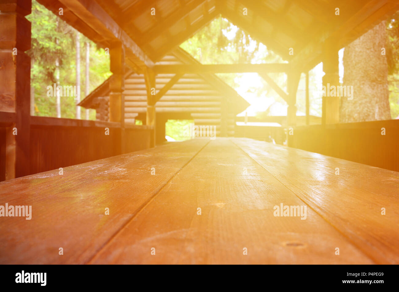 Interior of a wooden arbor handmade from dark wood in the woodland ...