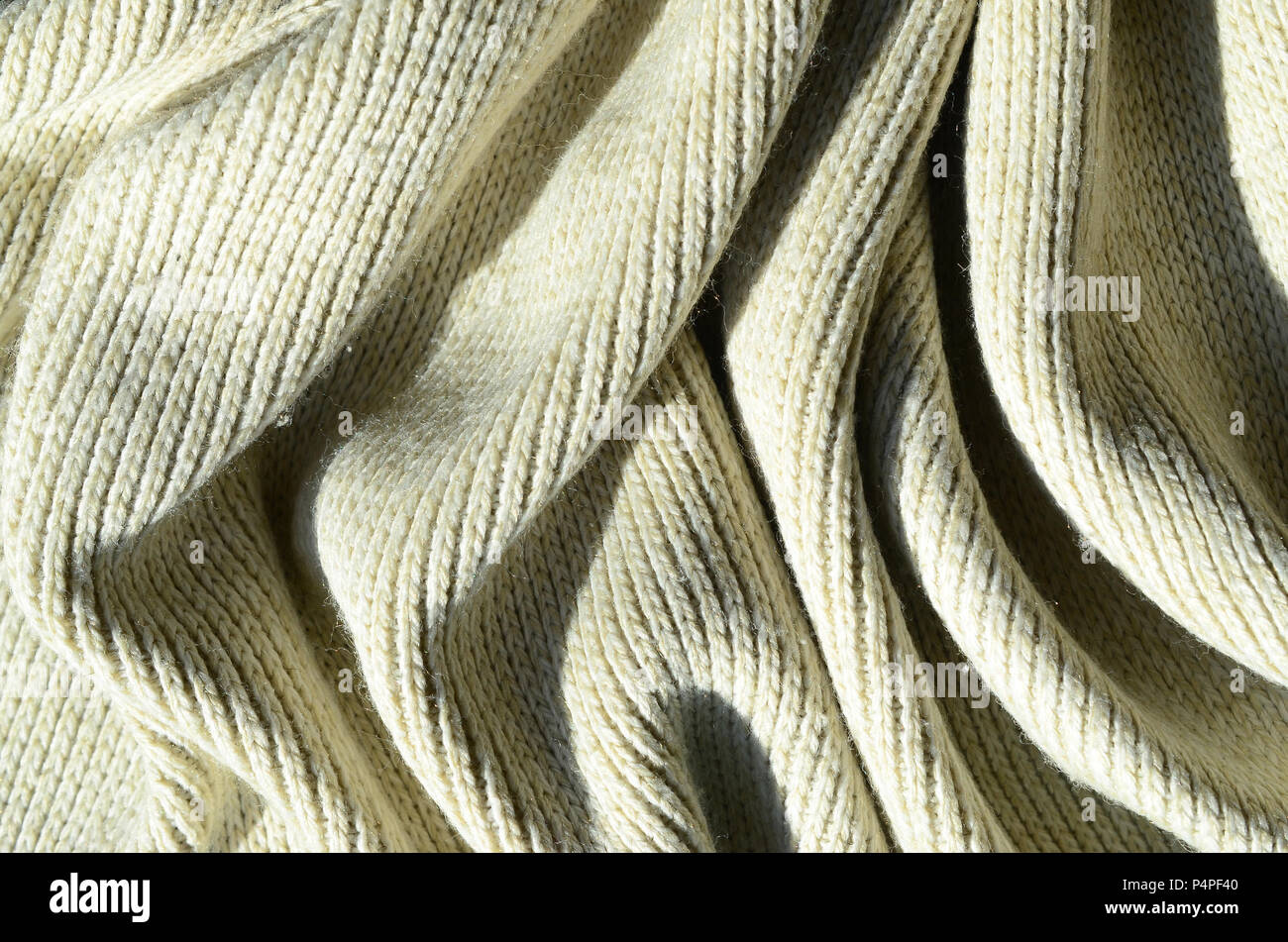 Fabric texture of a soft yellow knitted sweater. Macro image of the ...