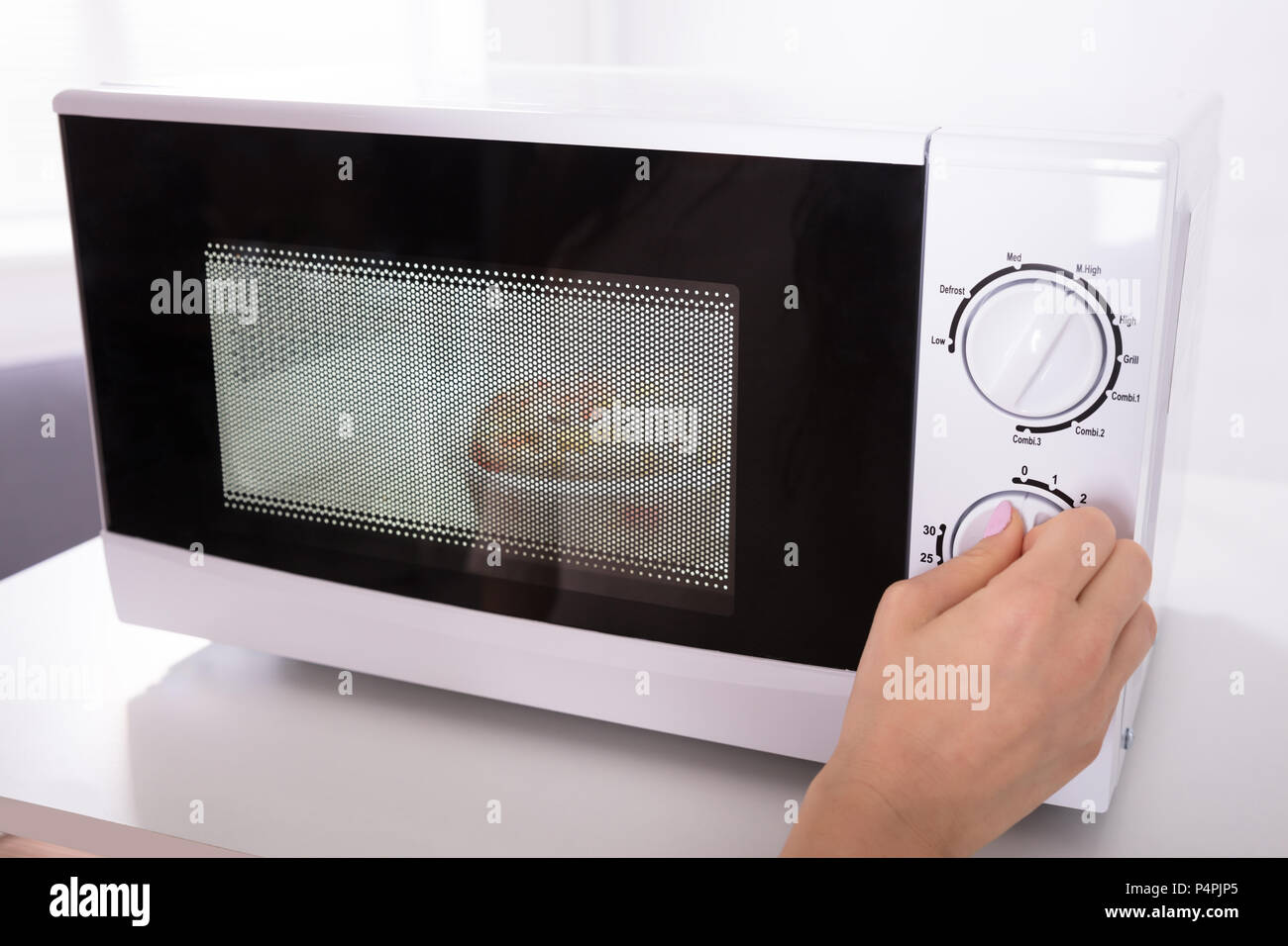 Using microwave oven hi-res stock photography and images - Alamy