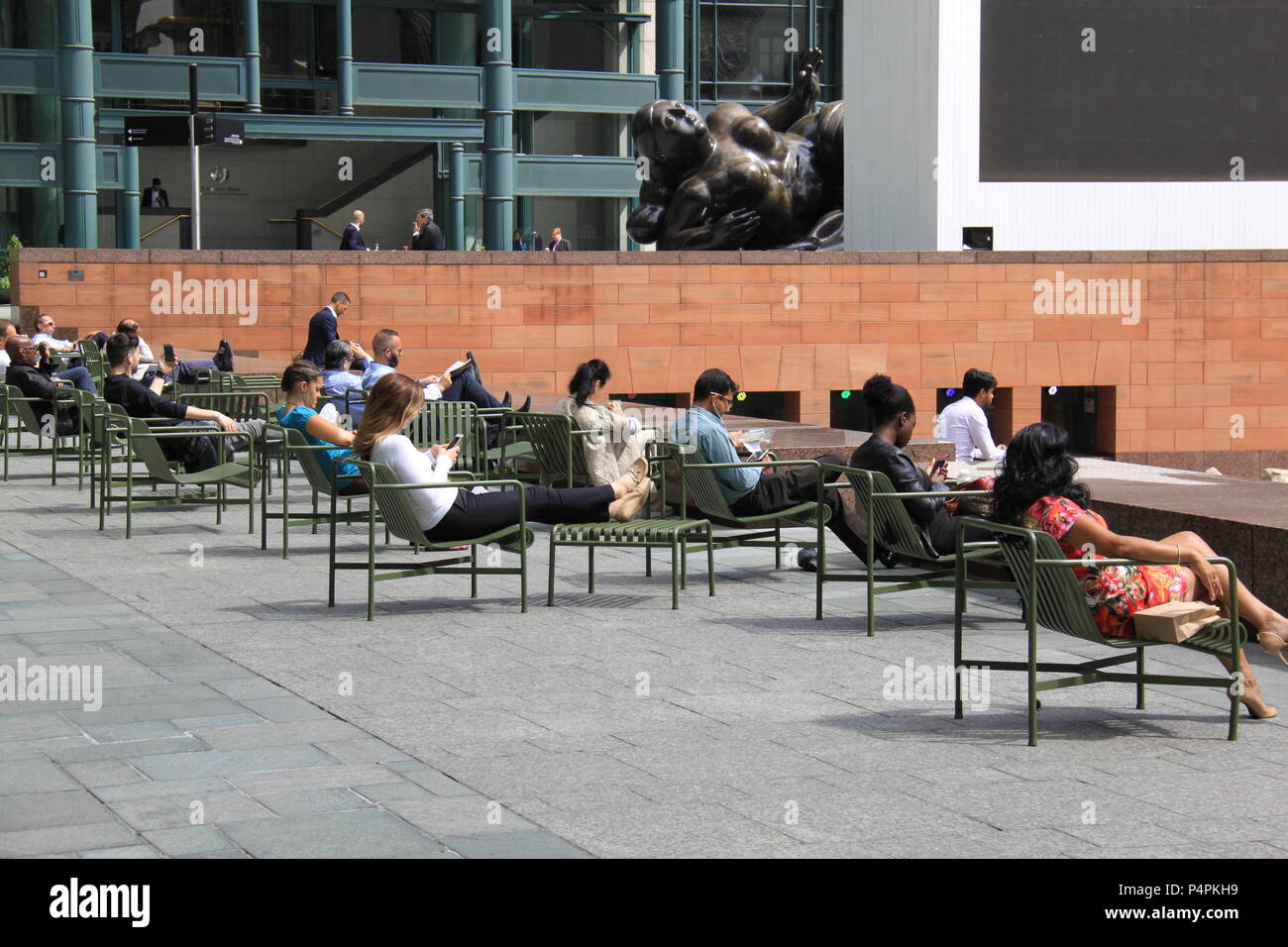 Office workers and staff relaxing at lunchtime in Exchange Square by ...