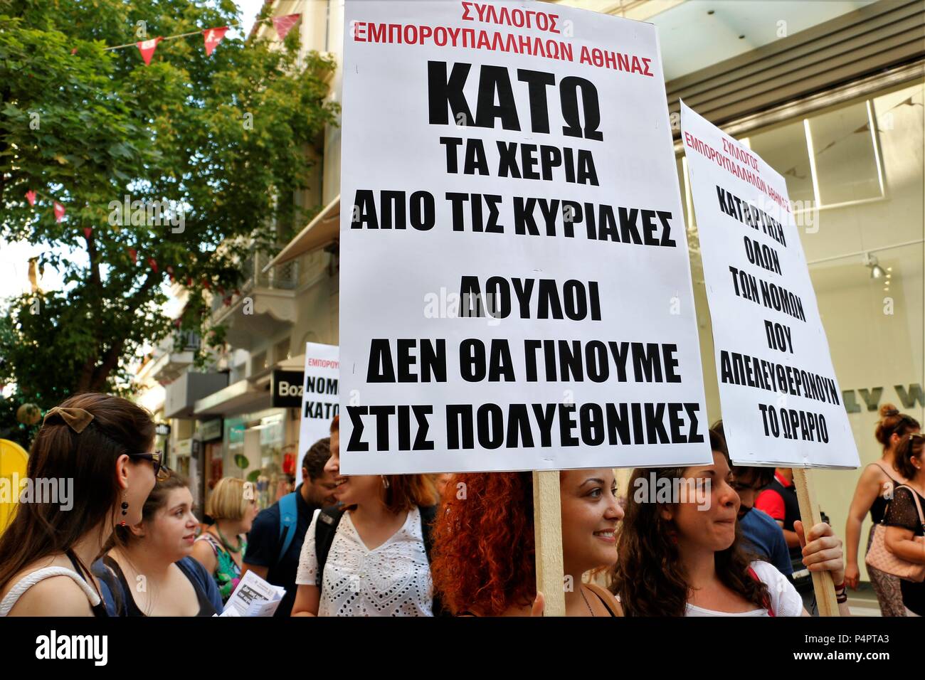 Women seen holding posters during the rally. Greek workers took to the ...