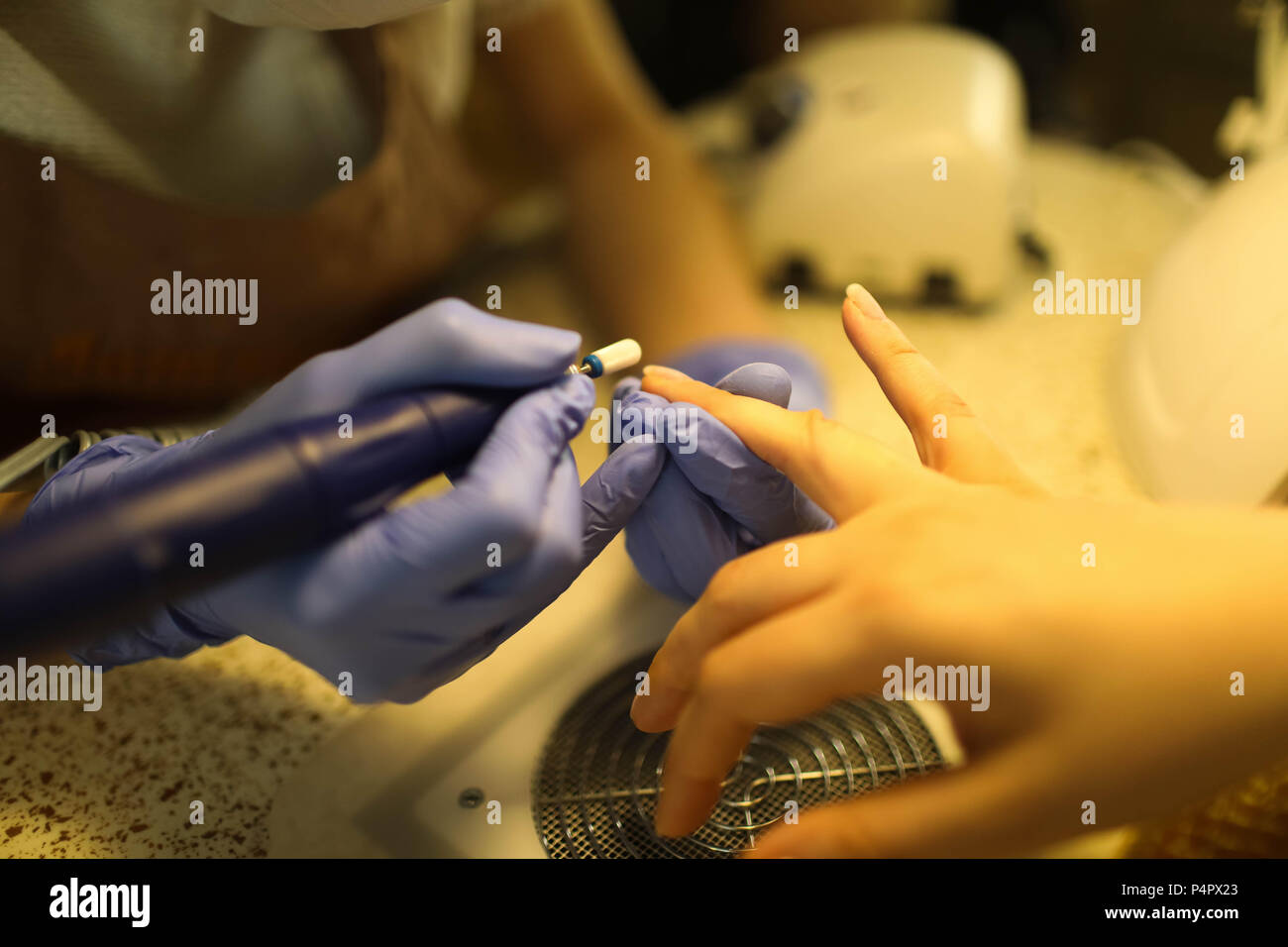 Beautician cleaning nails milling cutter hi-res stock photography and ...