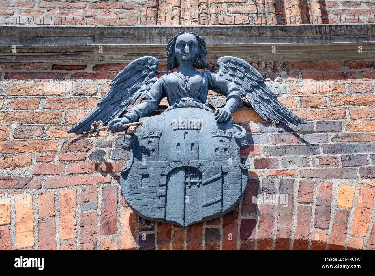 Torun, Poland - medieval arms, emblem of the city above the gate to the ...