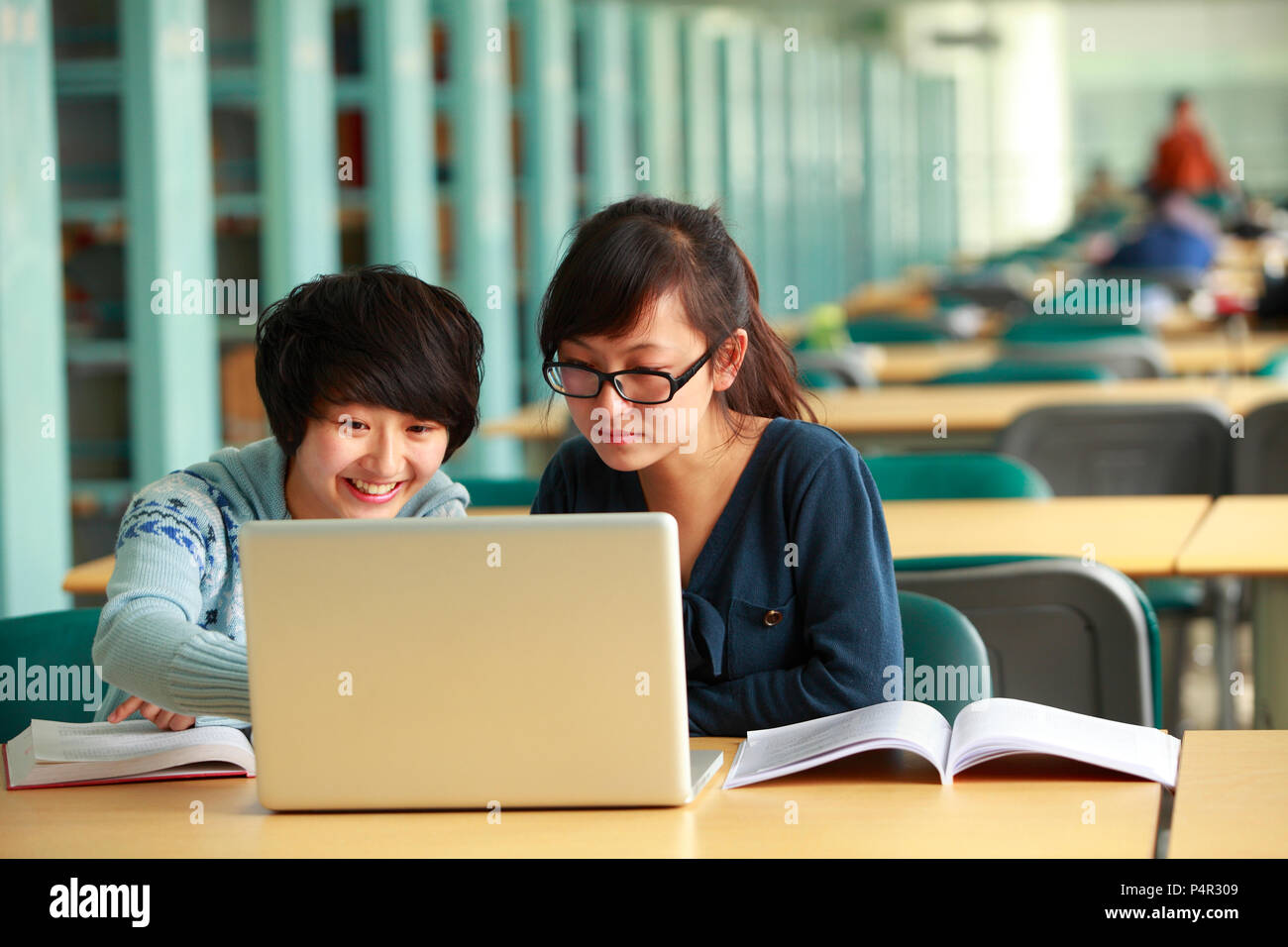 two female Chinese college students study in the library Stock Photo ...