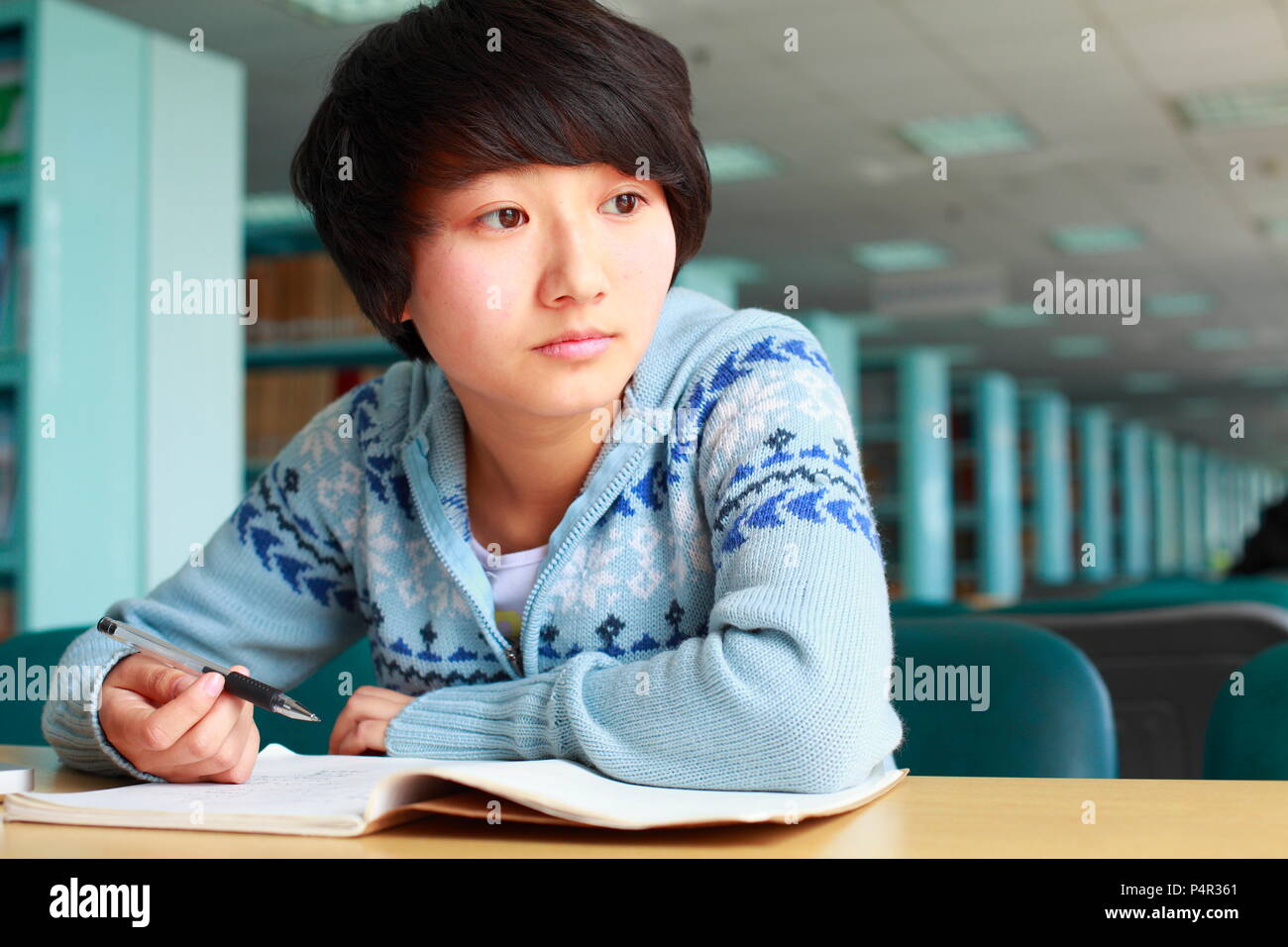 two female Chinese college students study in the library Stock Photo ...