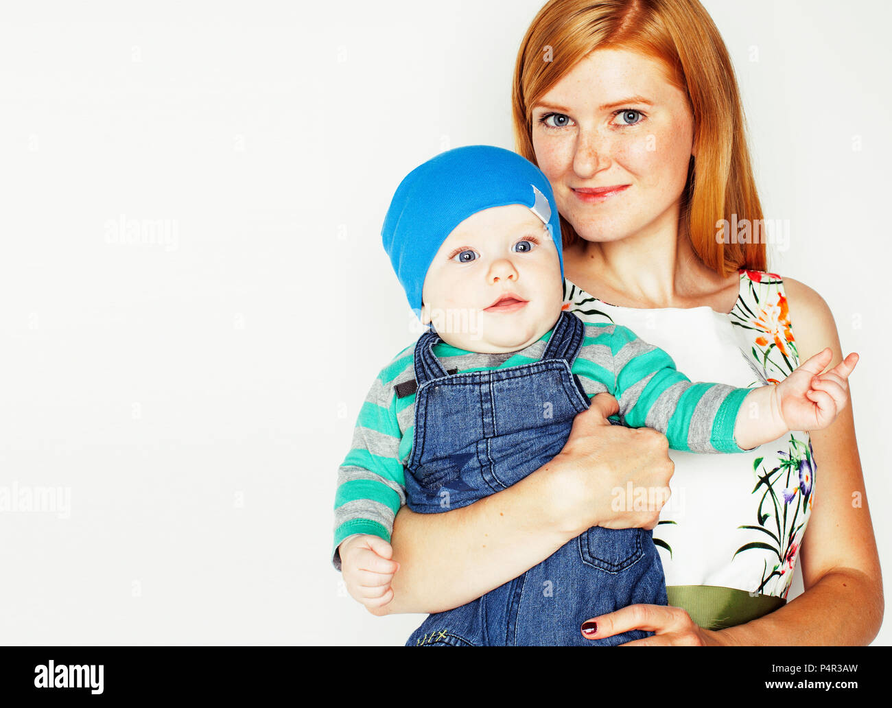 young beauty mother with cute baby, red head happy modern family ...