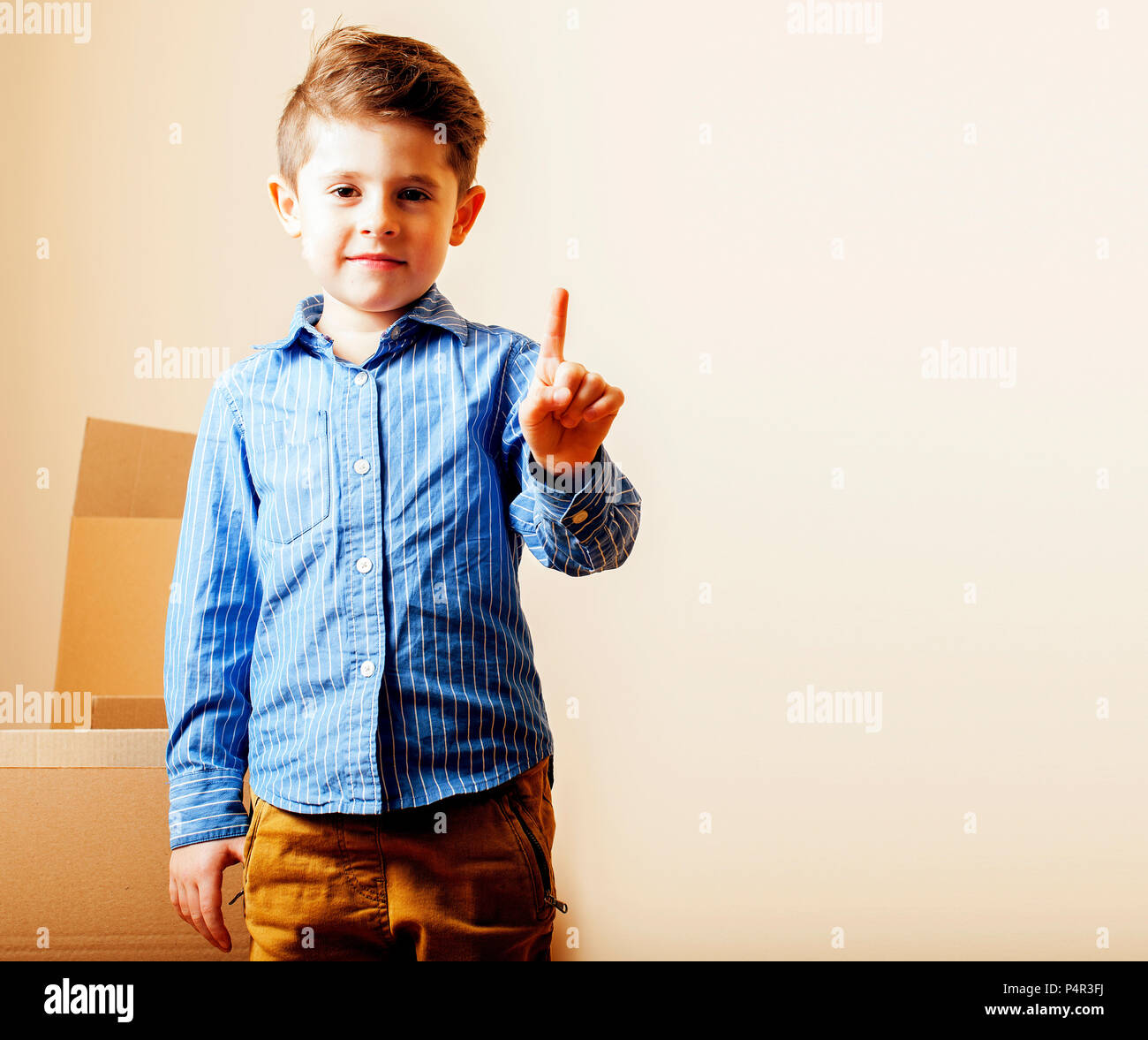little cute boy in empty room, remoove to new house. home alone ...