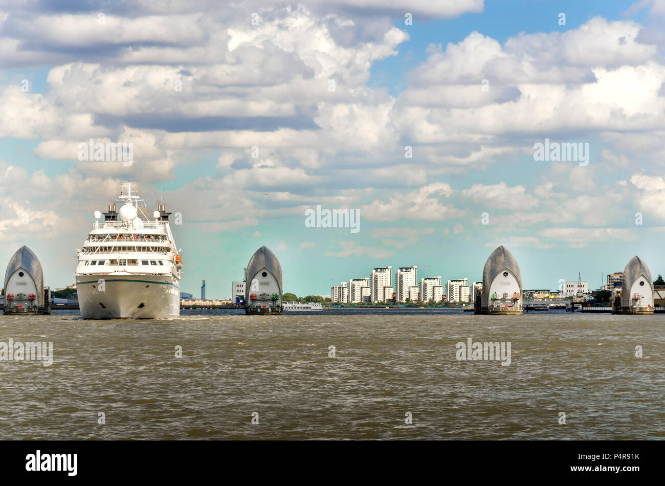 View of the Thames Barrier on a cloudy day under blue sky in London ...
