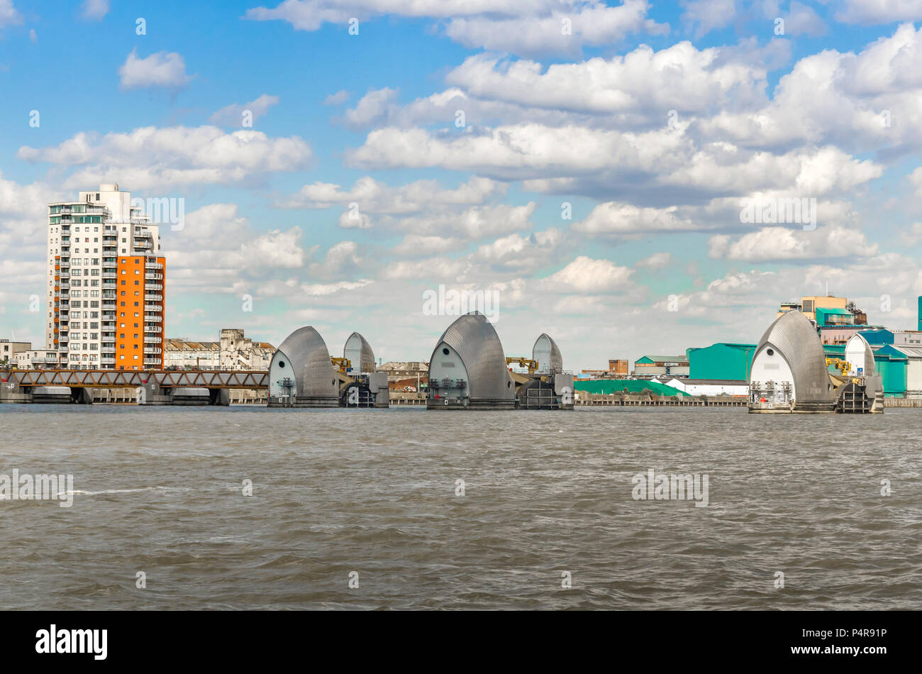 View of the Thames Barrier on a cloudy day under blue sky in London ...