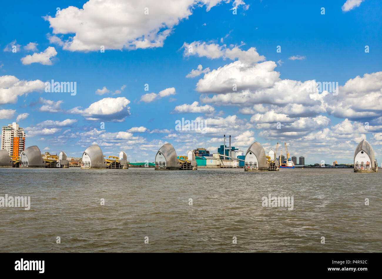 View of the Thames Barrier on a cloudy day under blue sky in London ...