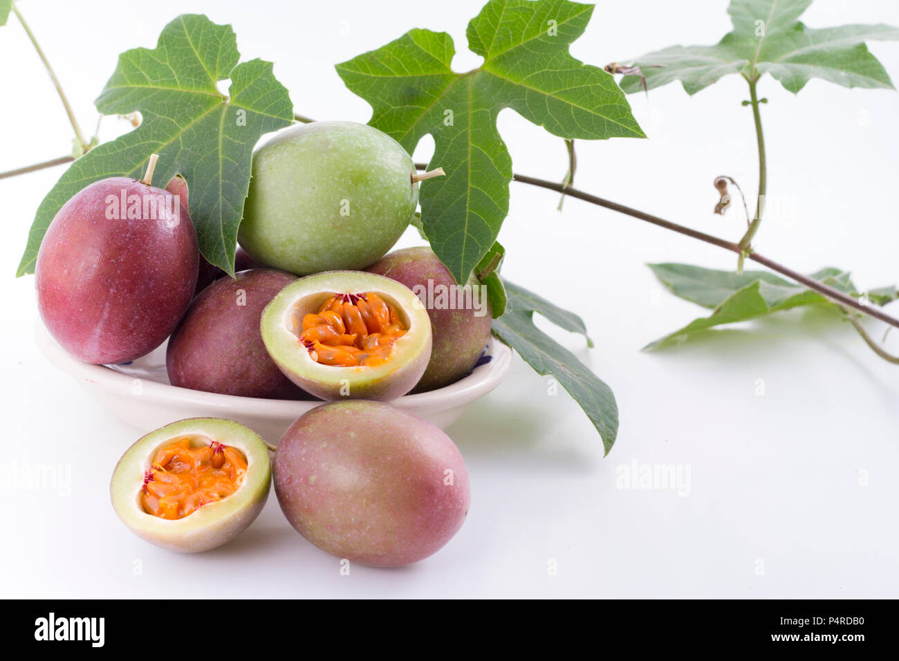 fruits of gulupa on vine wood table, Passiflora pinnatistipula Stock ...