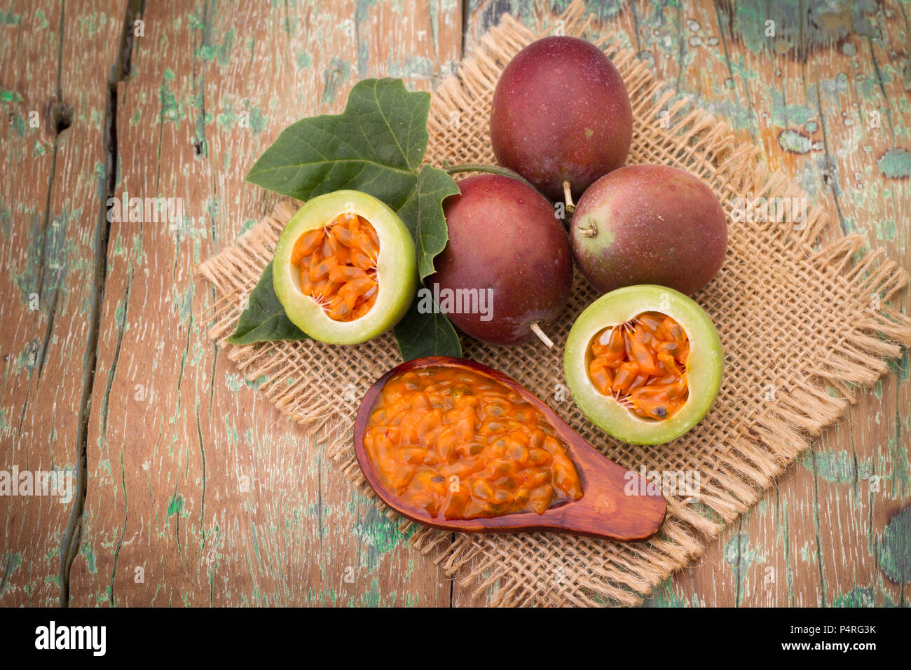 fruits of gulupa on vine wood table, Passiflora pinnatistipula Stock ...