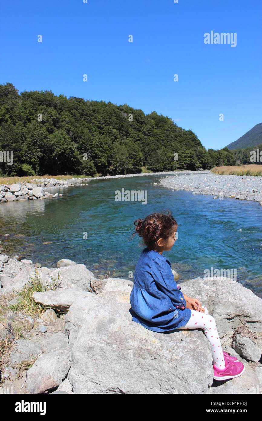 Girl sitting next river hi-res stock photography and images - Alamy