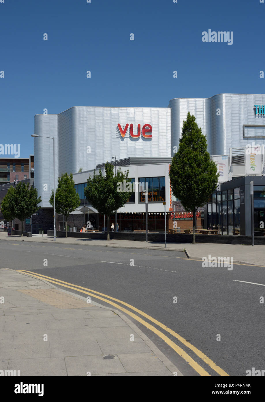 Modern buildings aluminium cladding, vue cinema, trees, pavement, road ...