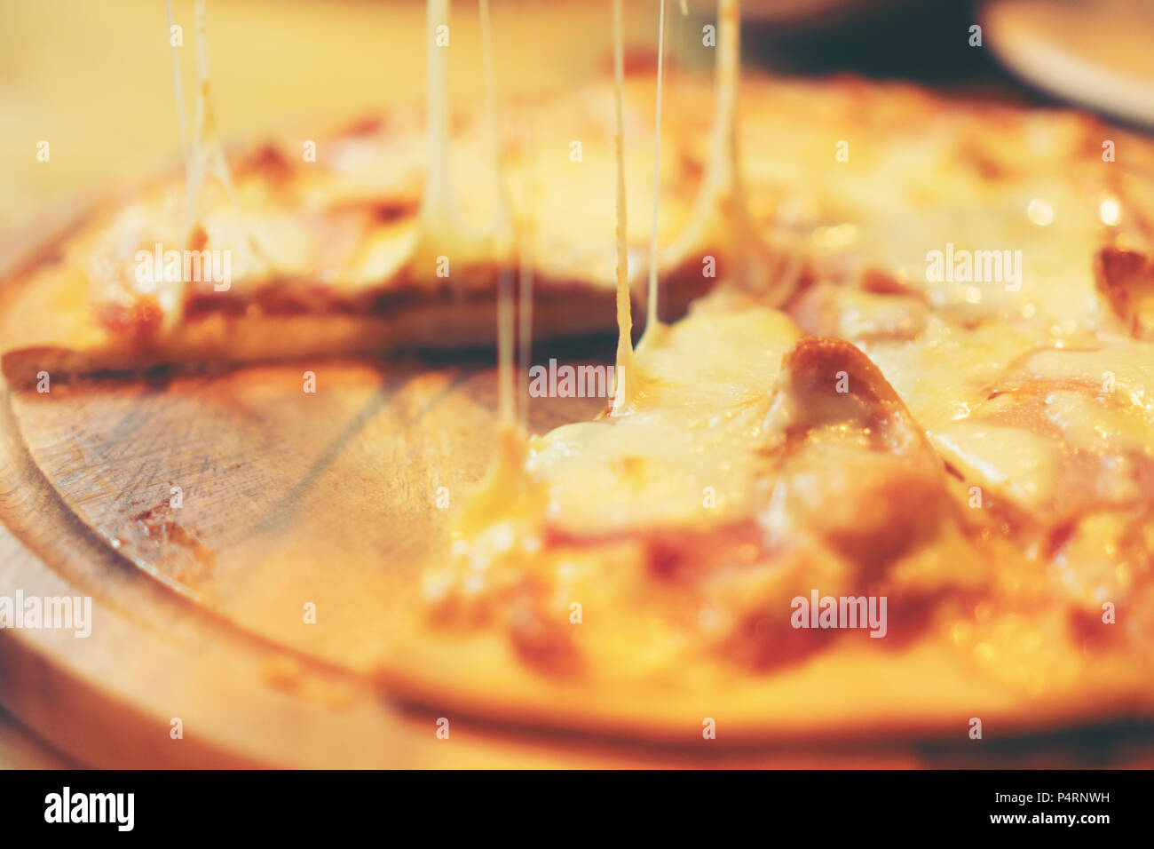 Homemade Pizza on a rustic wooden table Stock Photo - Alamy