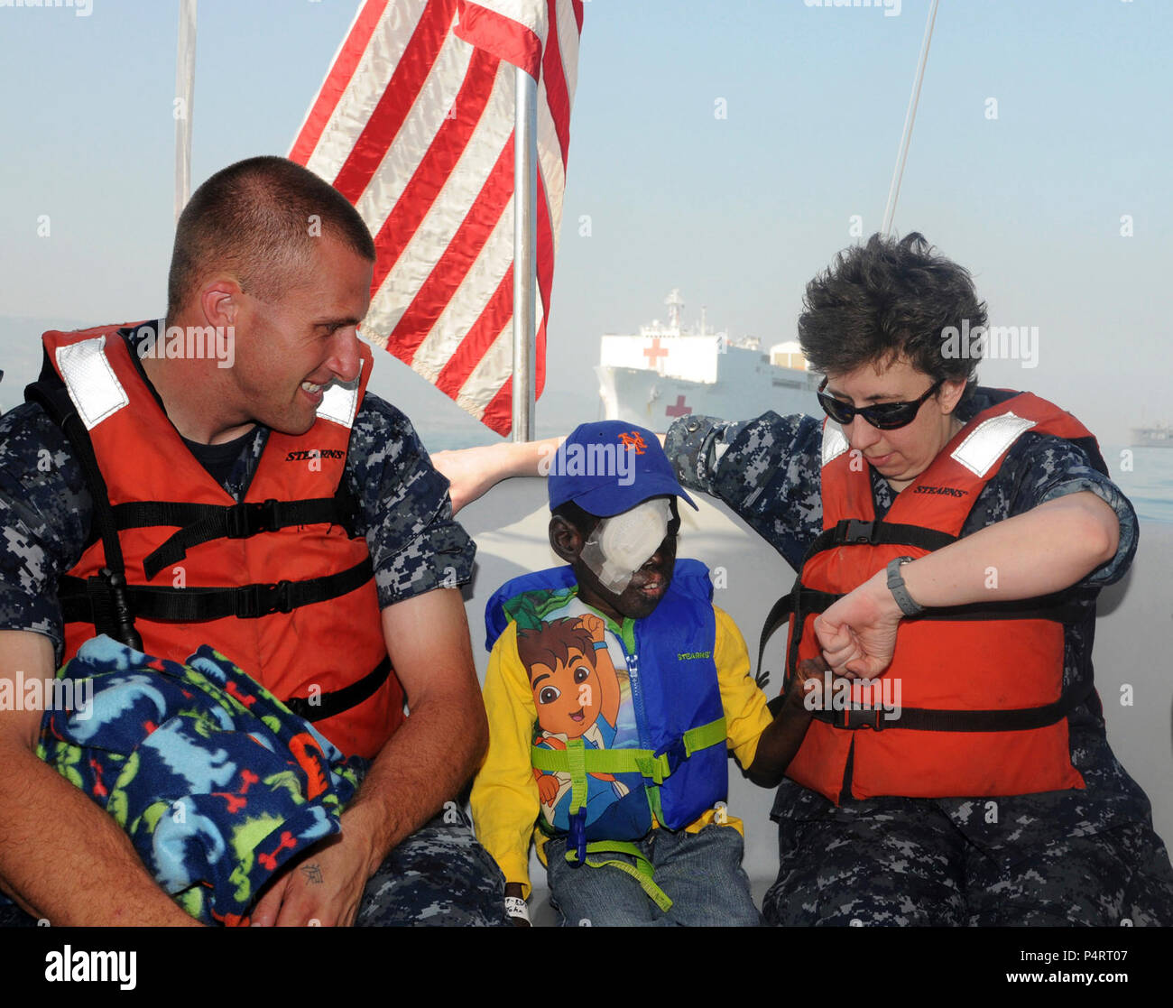 U.S. Navy Culinary Specialist 2nd Class Brendan Cameron, left, and Lt ...