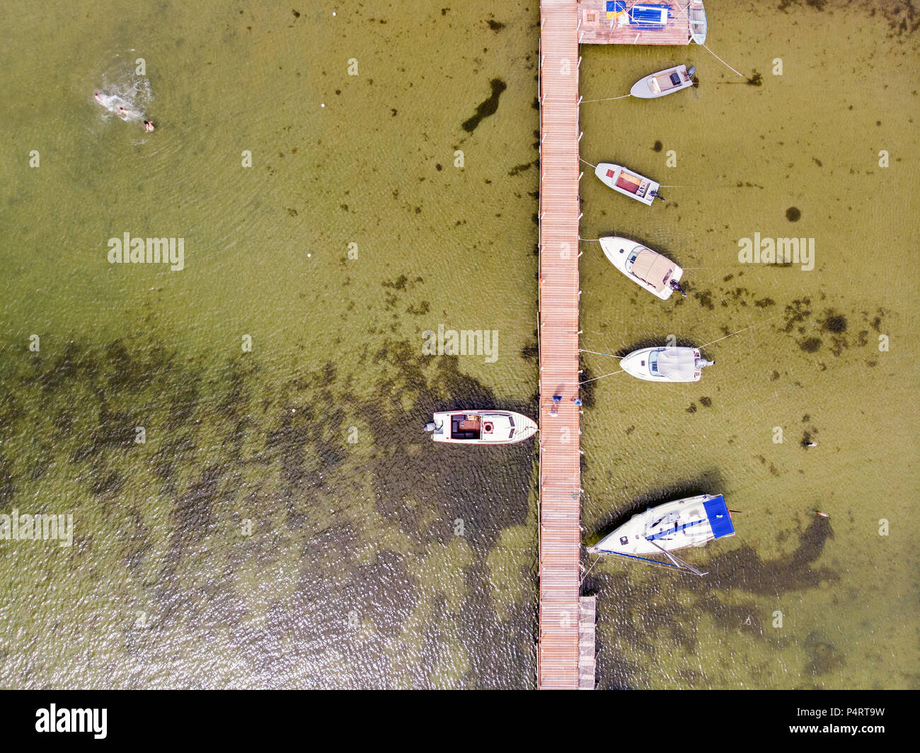 Pier with speed boats, marina lot. Aerial view from drone. Top view ...