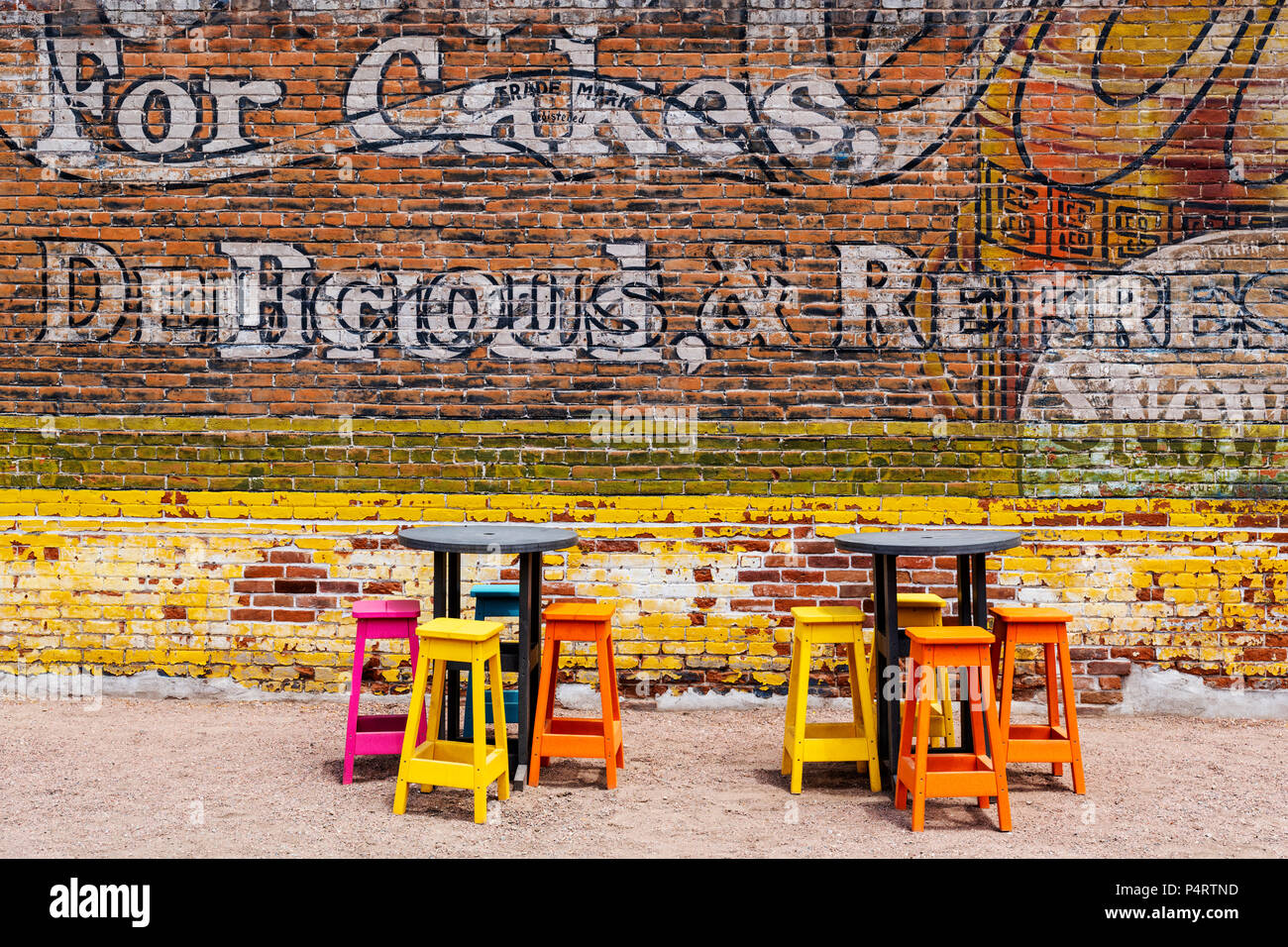 Colorful seats & mural on the side of the Boathouse Cantina restaurant ...