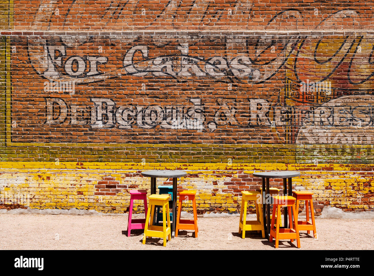 Colorful seats & mural on the side of the Boathouse Cantina restaurant ...