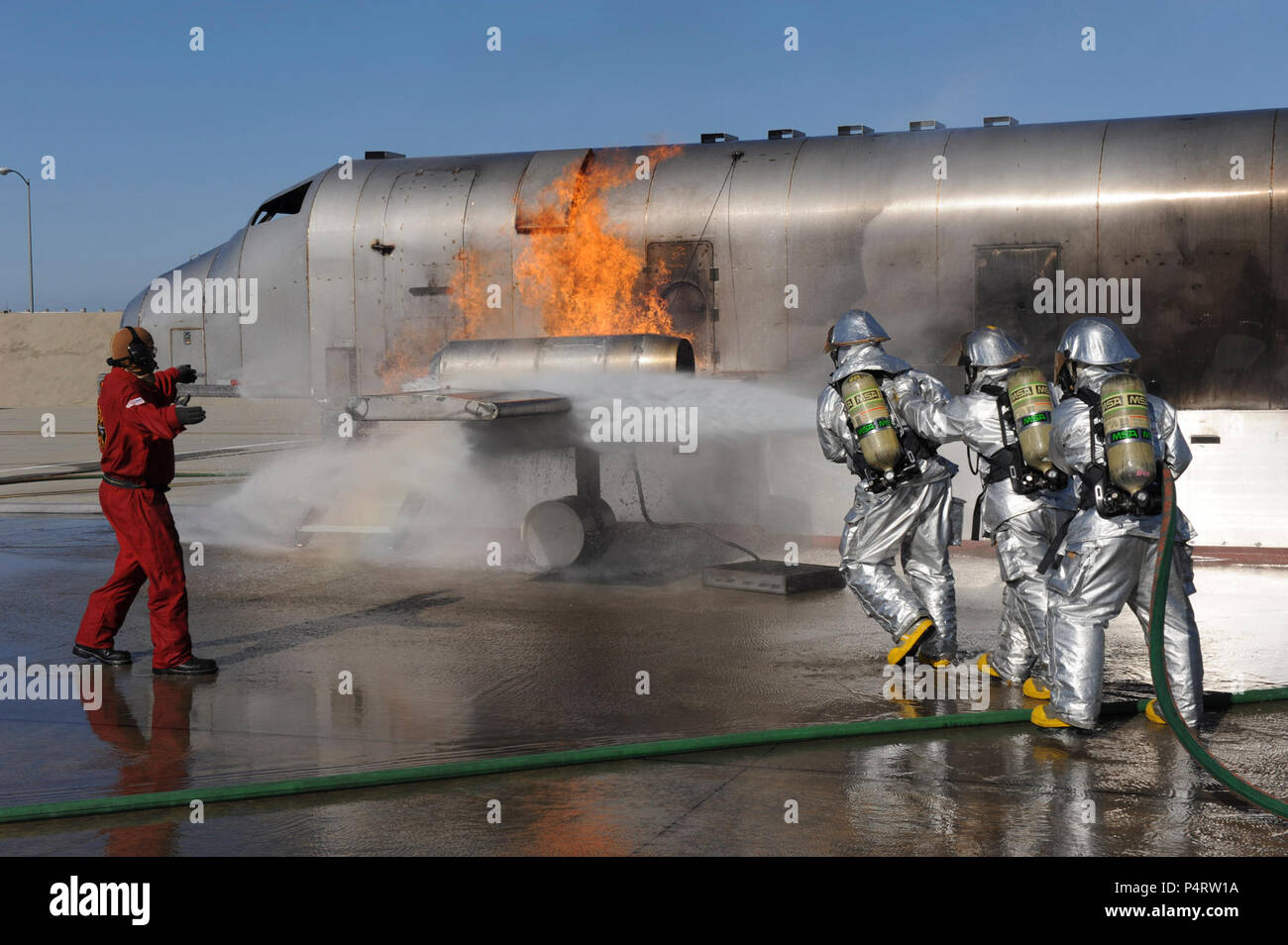 Firefighters battle flames on mobile aircraft fire trainer maft in hi ...