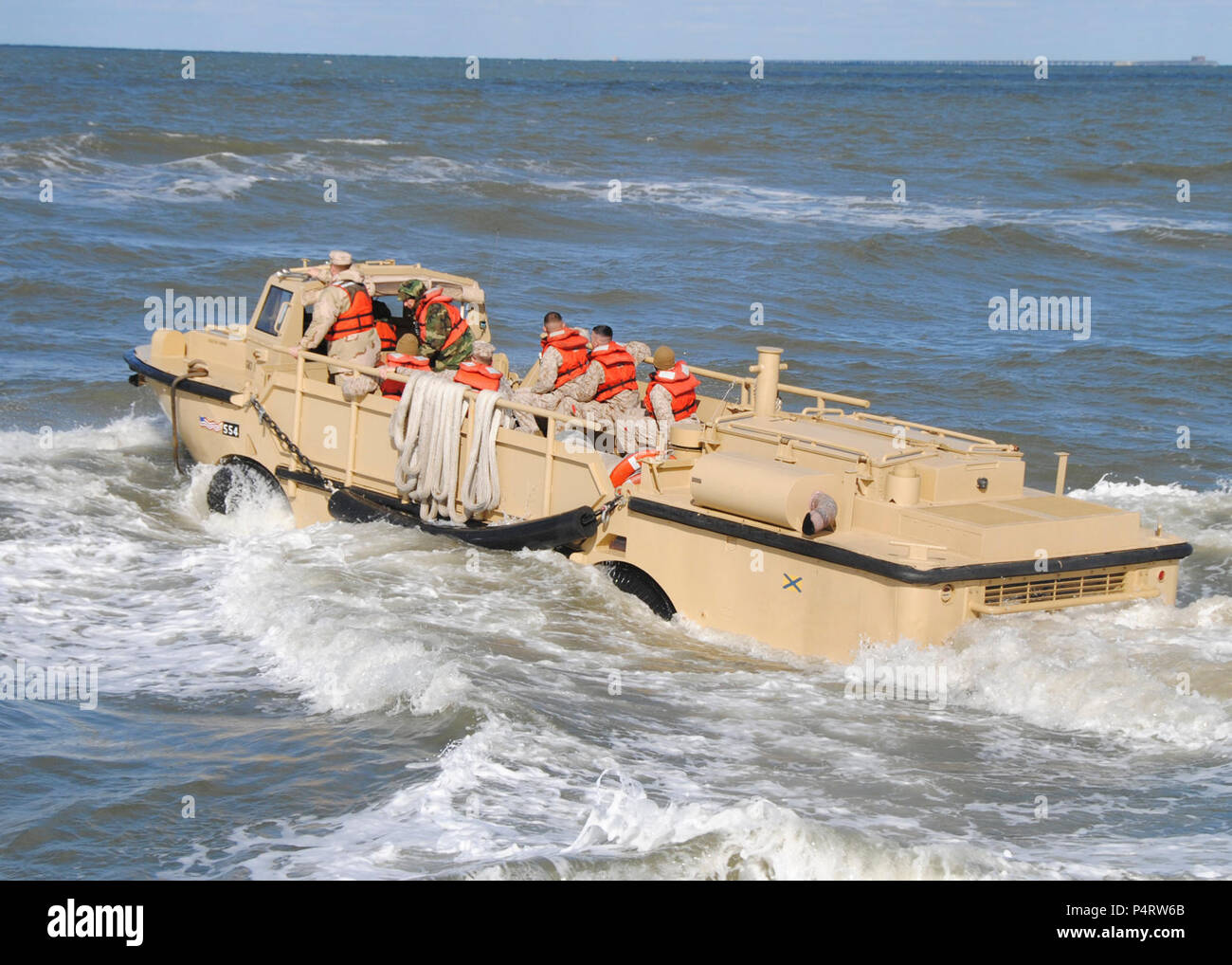 U.S. Sailors from Naval Beach Group 2 and Marines from 4th Landing ...
