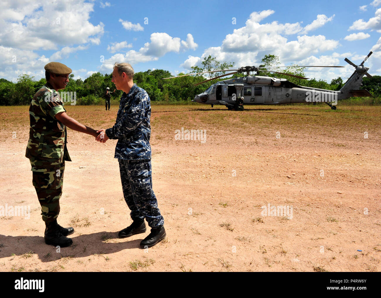 U.S. Navy Capt. Thomas M. Negus, right, the commodore of Continuing ...