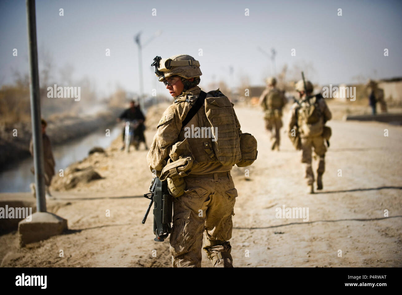 U.S. Marines with 3rd Battalion, 9th Marine Regiment patrol the streets of Marjah in Helmand ...