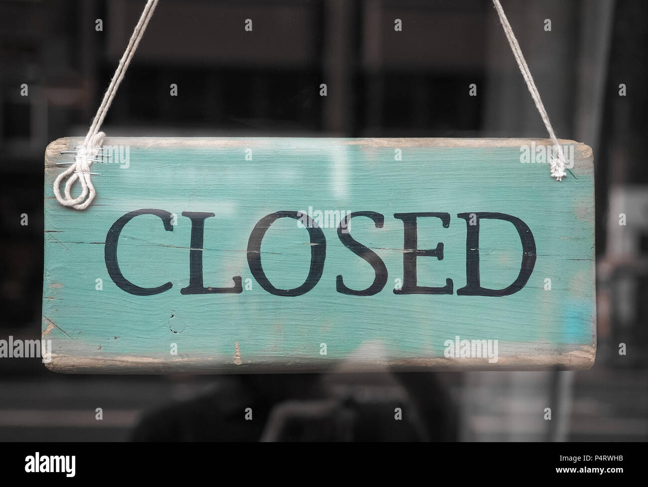Closed sign in a shop showroom with reflections Stock Photo - Alamy