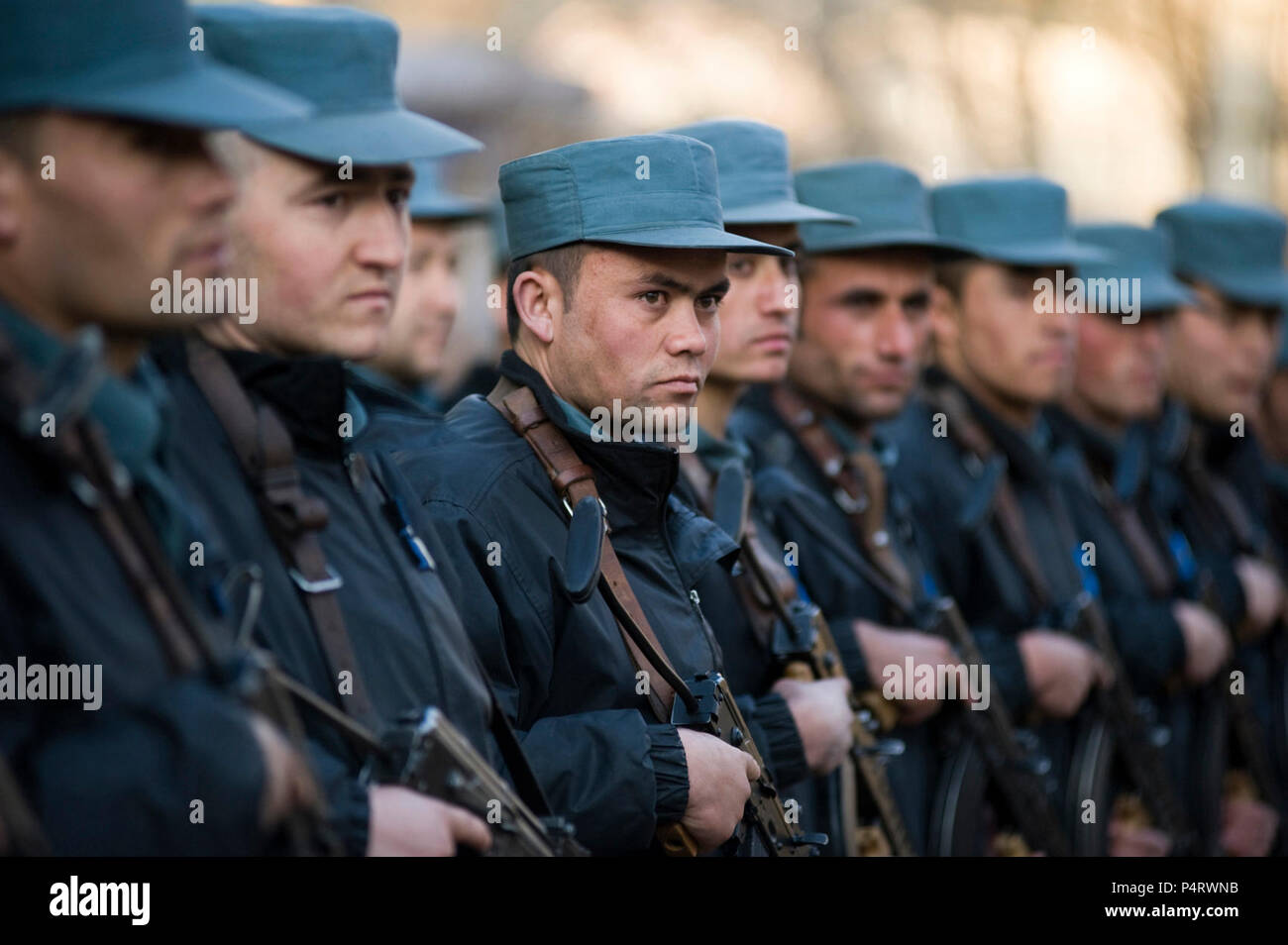 Students stand in formation to greet a congressional delegation at the ...
