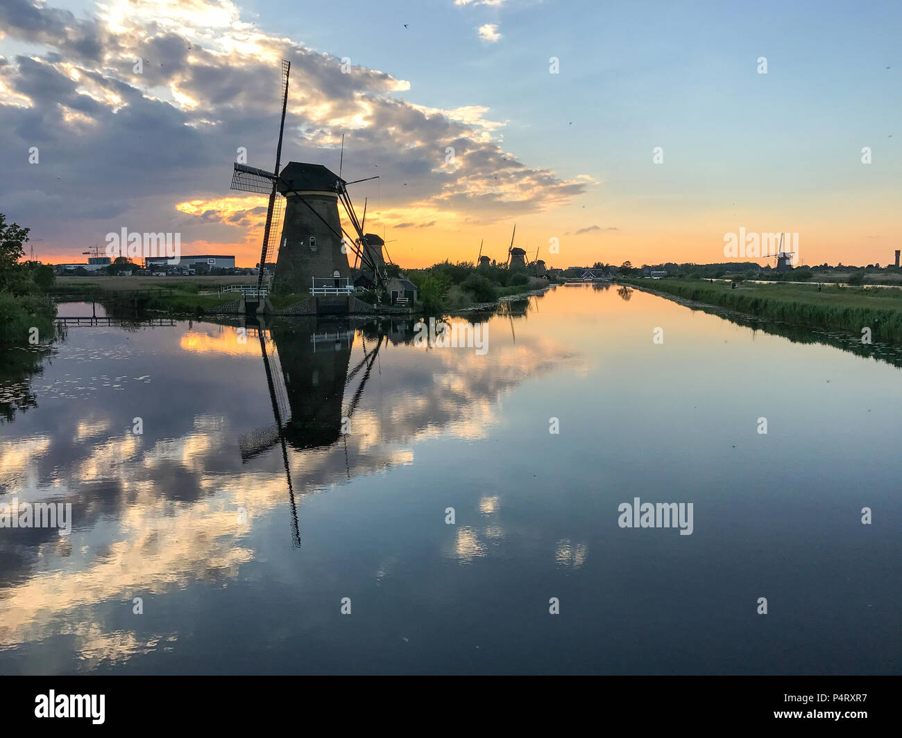 Beautiful dutch windmill landscape at the famous Kinderdijk canals ...