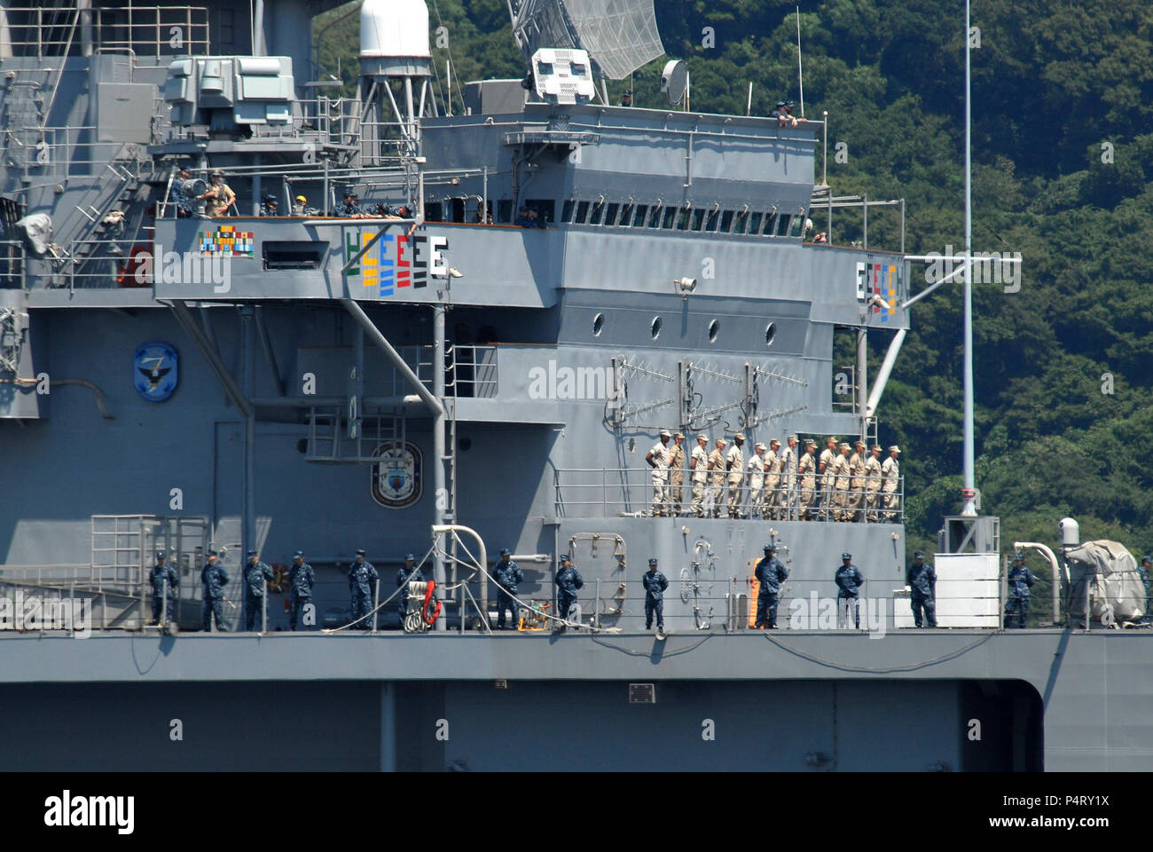 U.S. Sailors and Marines aboard the U.S. 7th Fleet flagship USS Blue ...