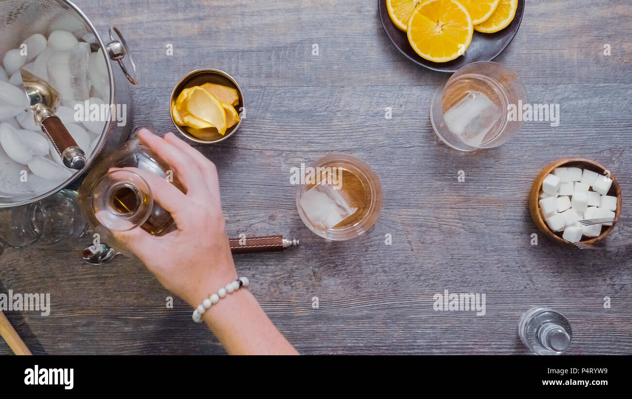 Step by step. Preparing Bourbon old fashioned cocktail at home bar ...