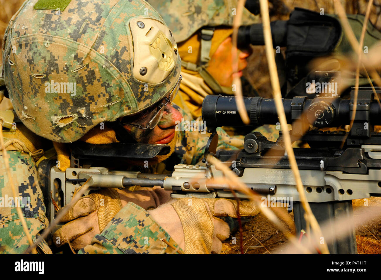 U.S. Marine Corps Lance Cpl. Matthew Guerrero, background, assigned to ...