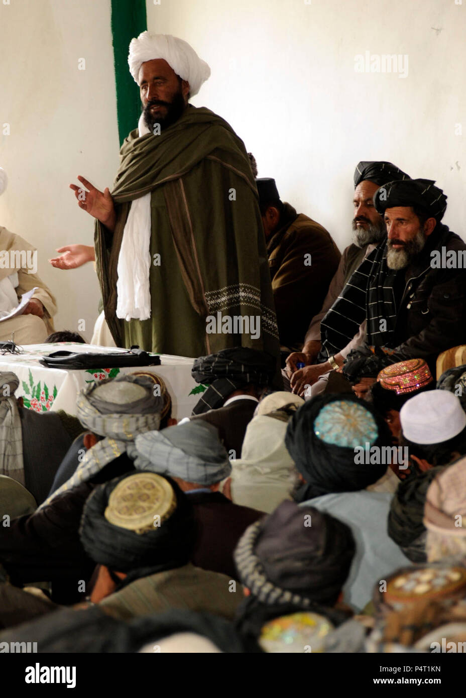 Abdul Samad, a former insurgent commander, speaks to village, district ...