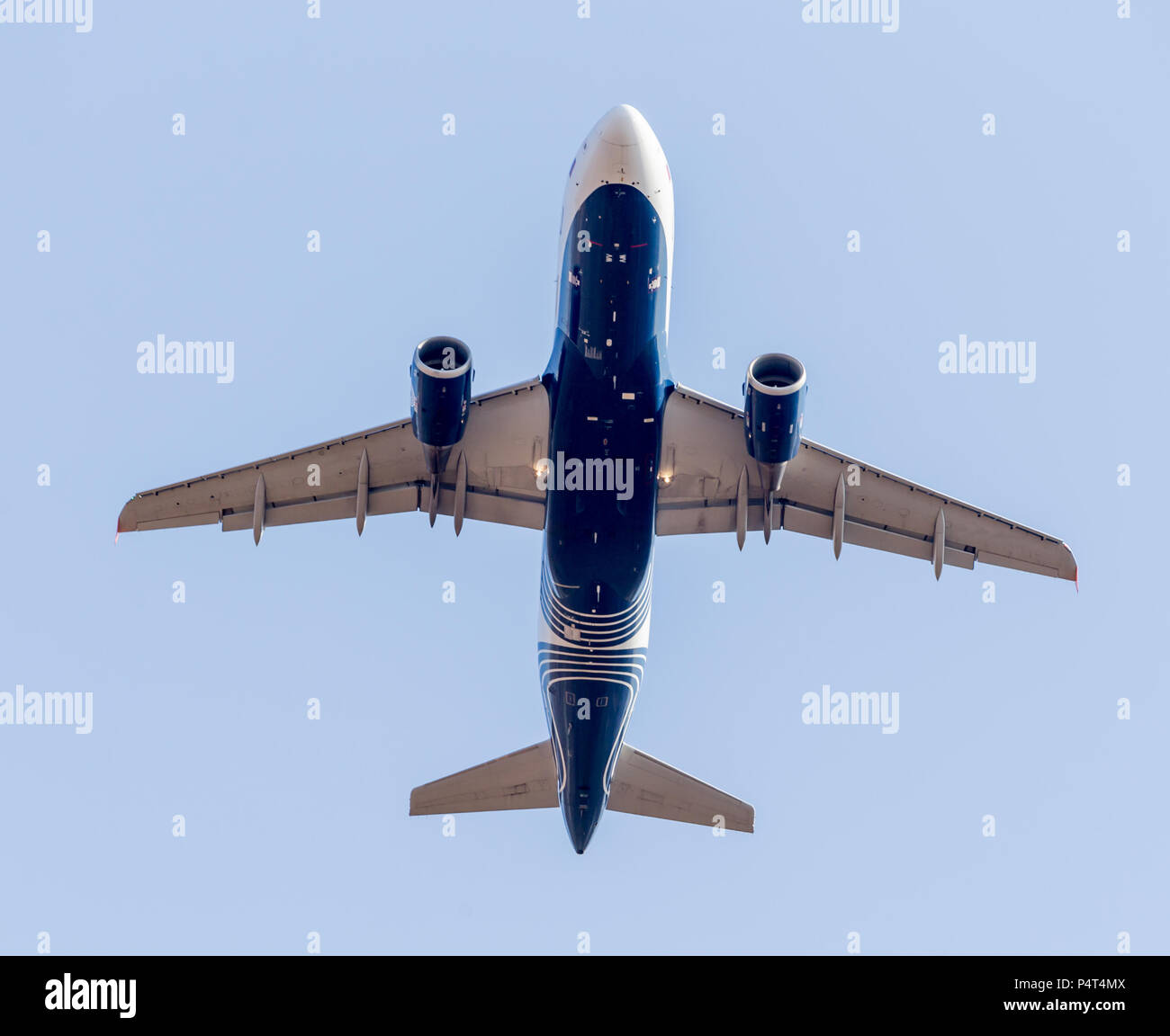 Commercial jet aircraft in blue sky. Airplane's fuselage. Aviation and ...