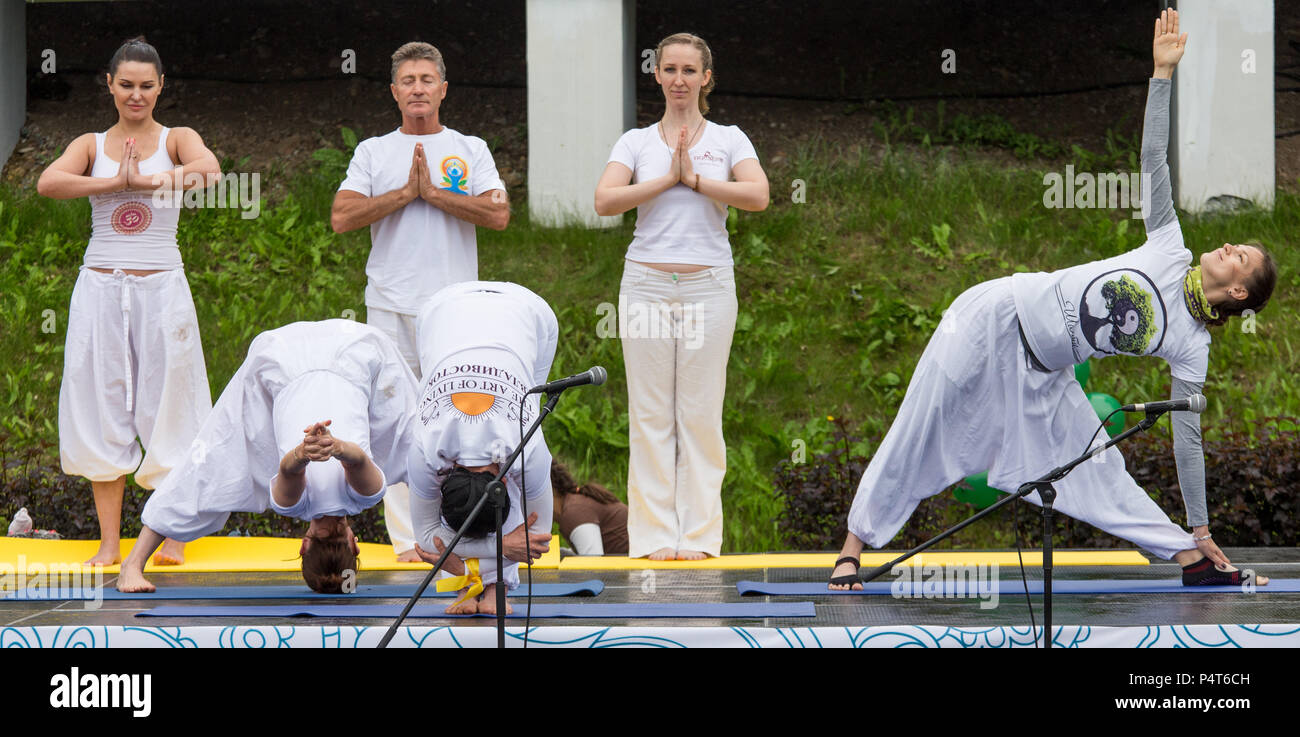 Russia, Vladivostok, 06/18/2016. Yoga trainers present yoga's asana on ...