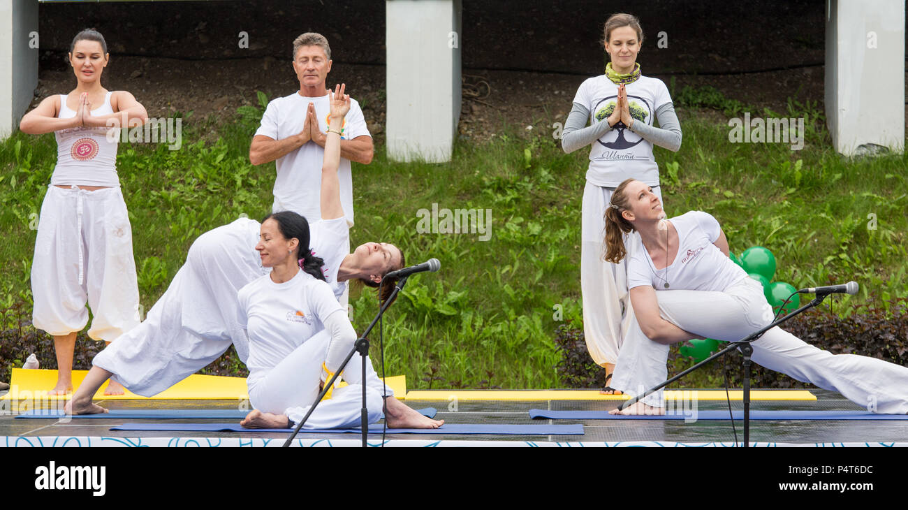 Russia, Vladivostok, 06/18/2016. Yoga trainers present yoga's asana on ...