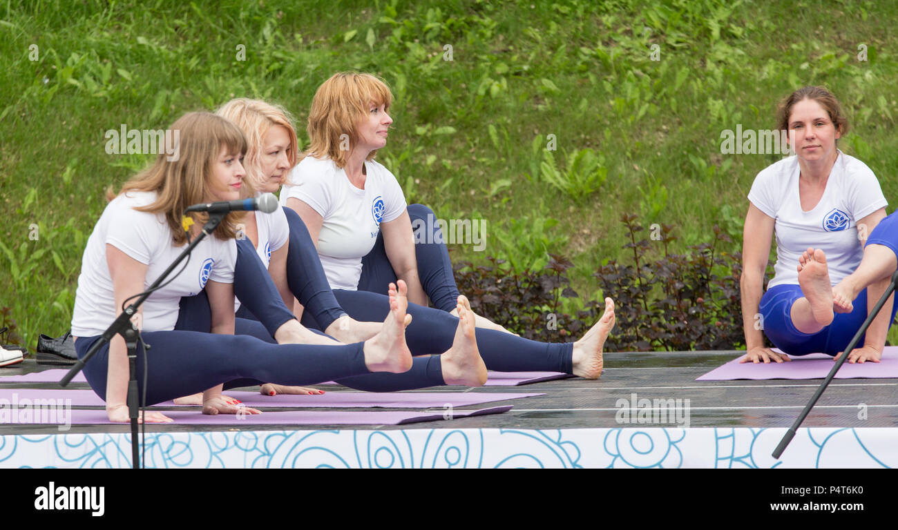 Russia, Vladivostok, 06/18/2016. Yoga trainers present yoga's asana on ...